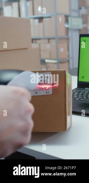 Postal Inventory Manager Scans Code on Cardboard Box with Scanner, Checks Package Information ...