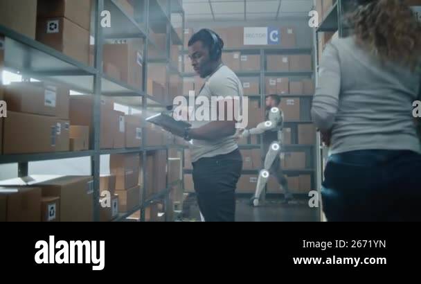 High-Tech Advanced Warehouse: African American Inventory Specialist ...