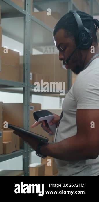 High-Tech Warehouse: African American Inventory Specialist in Headset ...