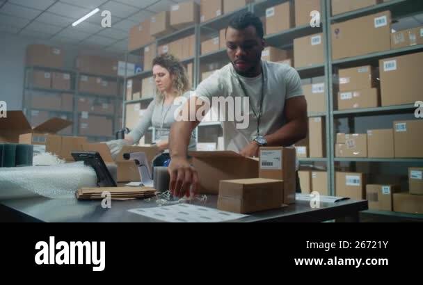 Multiethnic Delivery Service Workers Packing Cardboard Parcels with Online Goods, Food, Scanning ...