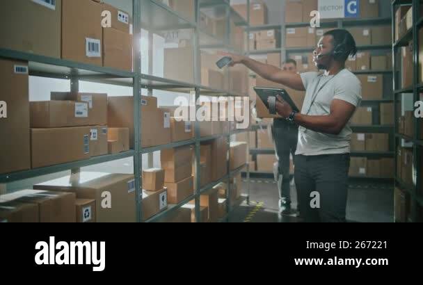 High-Tech Modern Warehouse: Worker Wearing Futuristic Full Body Robotic ...