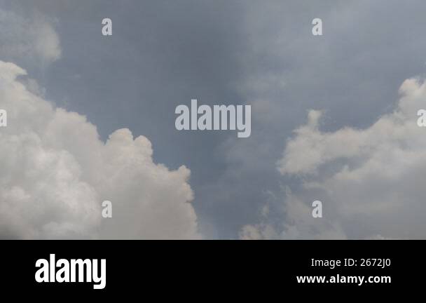 timelapse of clouds with clear sky at noon in summer. texture effect ...