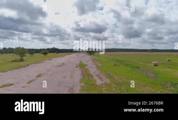Aerial view of remains of old Kogula (soviet) airfield in cloudy summer ...