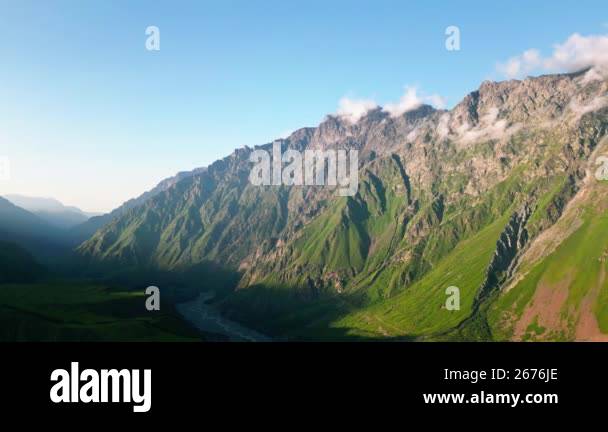 Aerial view of green Caucasus mountains. Majestic peaks with lush ...