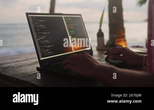Male Programmer Writes Code Working Remotely Near Palm Trees Sea