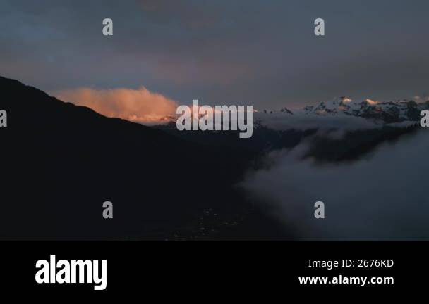 Aerial sunset over Mazeri village in Svaneti mountains. Sunlight hits ...