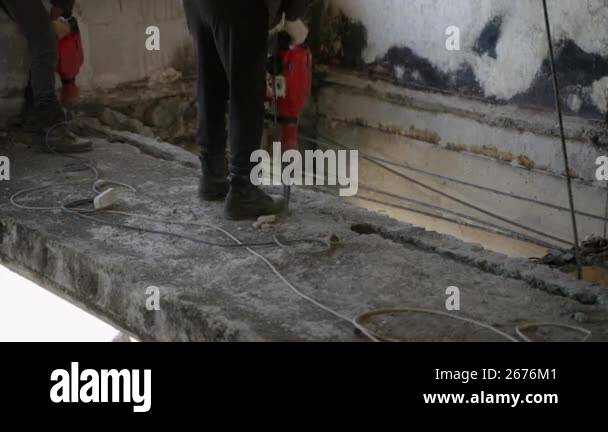 Boots, tools, debris illustrate tough work conditions. Construction ...