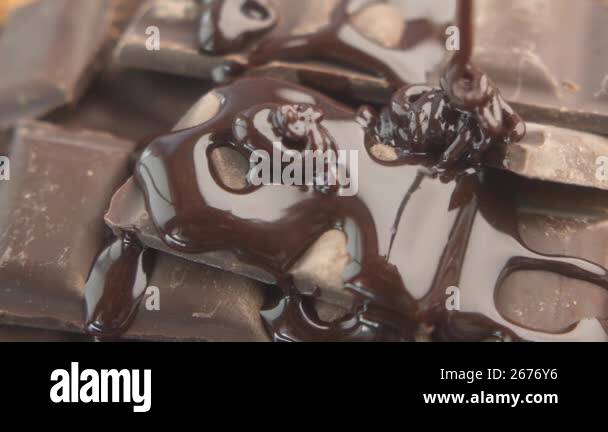 Delicious dark chocolate is beautifully drizzling over rich and creamy ...
