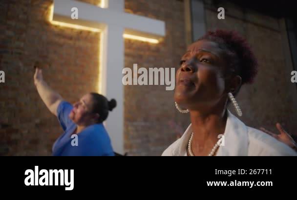 African American woman singing passionately during worship service ...
