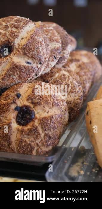 Freshly baked artisan bread rolls topped with seeds, delivering savory ...
