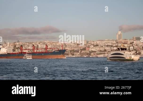 Istanbul harbor with cargo ship and ferry Stock Video Footage - Alamy