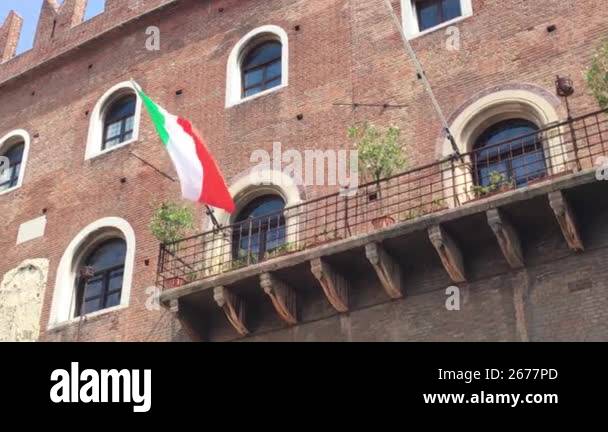 Verona, Italy 1 January 2025: The italian flag waves gently on a ...