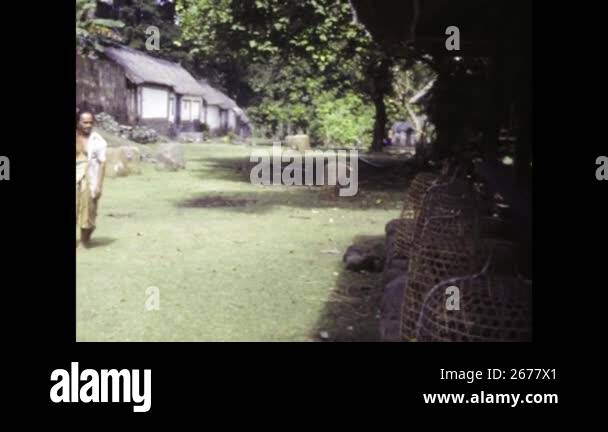 Denpasar, bali june 1985: traditional balinese village life and cyclist ...