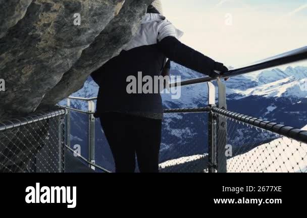 Cautious Alpine Journey - Close-Up of Prudent Woman Navigating Metal ...