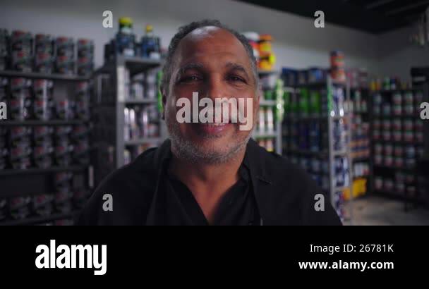 Close-up portrait of a small business owner in a hardware store ...