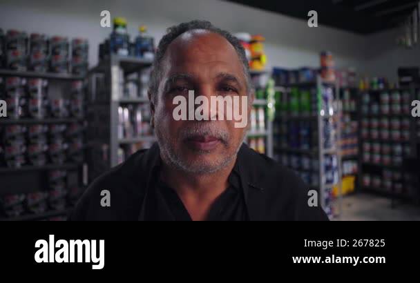 Close-up portrait of a small business owner in a hardware store ...