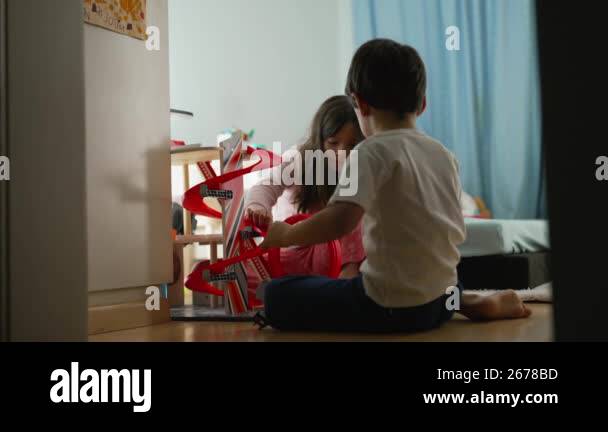 Evening Playtime for Brother and Sister, Engaged in Floor Play with ...
