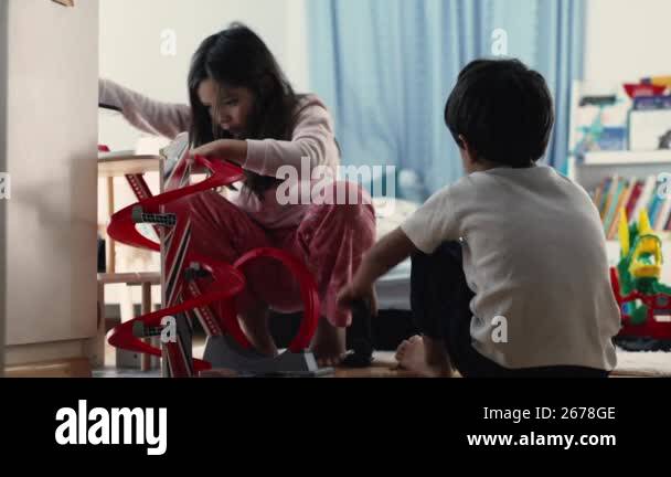 Candid Evening Playtime of children playing with Parking Lot seated in ...