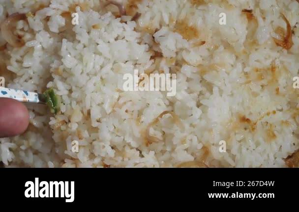 Close-up of a spoonful of cooked rice Stock Video Footage - Alamy