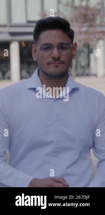 Vertical. Portrait young adult Latin business man commercial outside ...