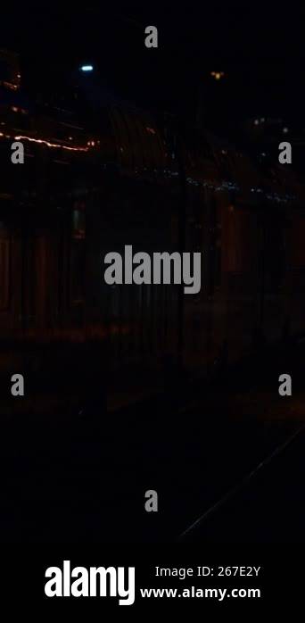 Train moving through the Cannes, France train station in the evening ...