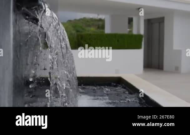 A stylish and visually appealing water feature that is seamlessly ...