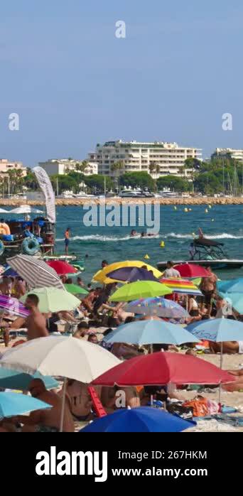 Cannes, France - October 15, 2024: People swimming and relaxing on the ...