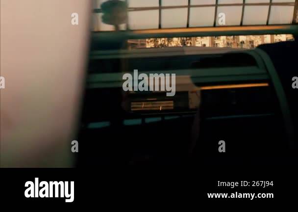 Close up view from a window of a train moving on the rails near a ...