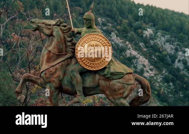 Eze, France - November 24, 2024: Bronze warrior statue at the top of a ...