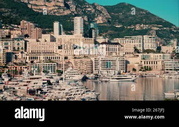 View of boats docked in the Monaco Marina with the skyline of the city ...