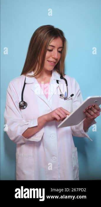 vertical Healthcare professional wearing crisp white lab coat and ...
