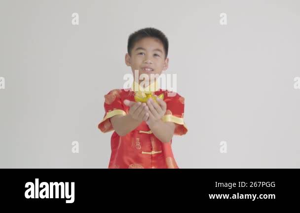 Chinese New Year. Happy Asian Chinese kid Boy smile wearing red ...