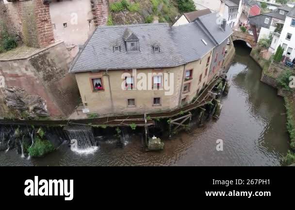 Traditional water mill building on the saar river in saarburg, germany ...