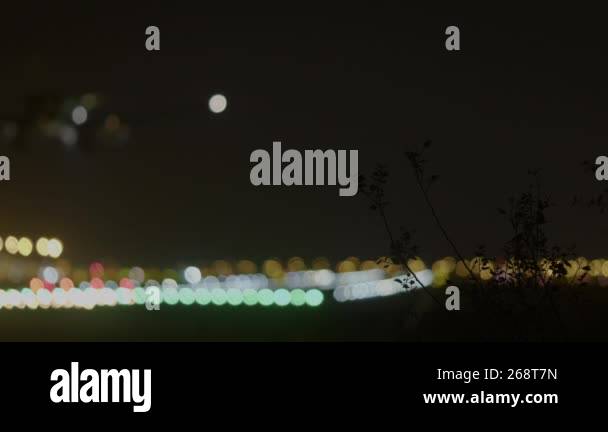 Nighttime airplane landing, illuminated runway lights guiding passenger ...