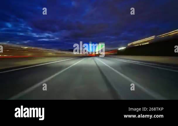 Timelapse of road drive along the highway. Front view to the road and ...