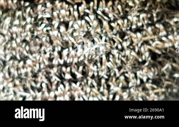 Focus in stainless steel scrubber, metal pot sponge background, micro ...