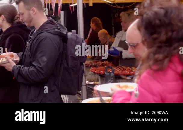 Food market, people from various backgrounds come together to enjoy a ...