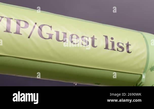 A detailed closeup view of a VIP or Guest list banner displayed at the ...