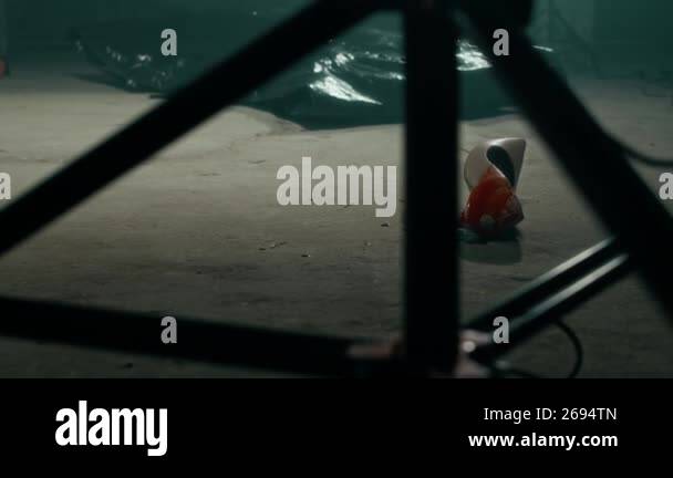 No people low-key shot of murder scene location with corpse under black ...