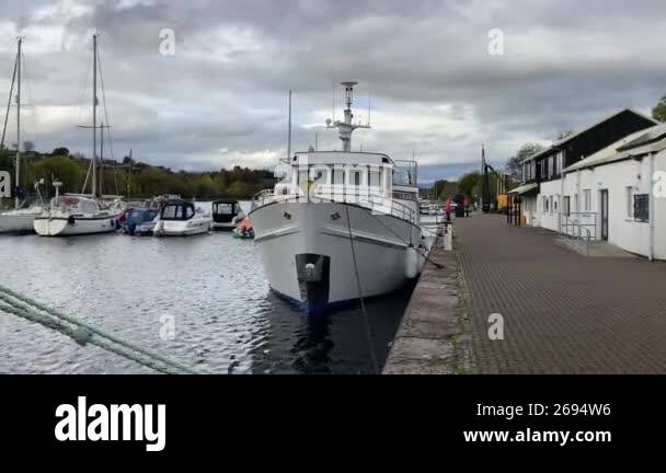Boats moored at the dock. Muirtown Basin Marina on the Caledonian Canal ...