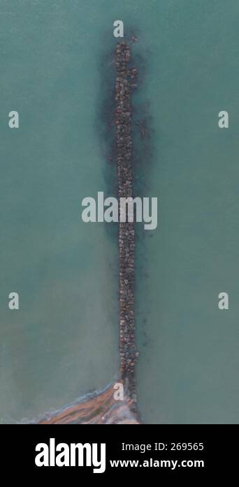 Rocky breakwater on blue sea in Spain. High quality 4k footage Stock ...