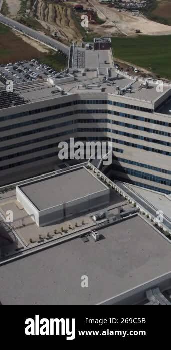 Aerial view of hospital emergency entrance helipad and buildings ...