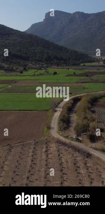 The view from the overhead of the agricultural land and dirt road ...