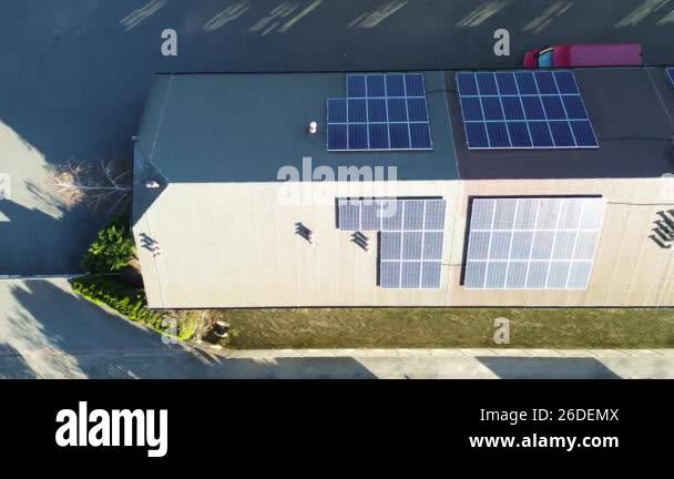 Suburban house rooftop with solar panels Stock Video Footage - Alamy