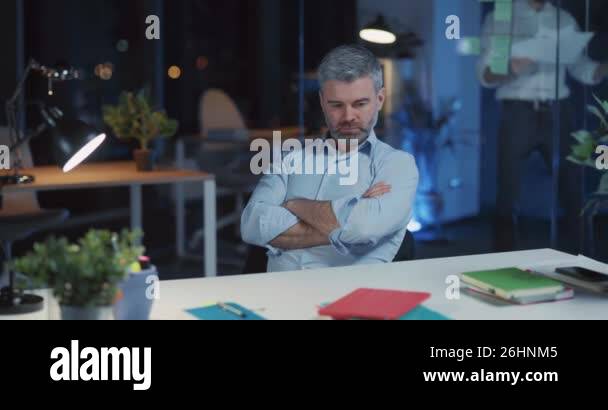 Tired millennial businessman sitting frustrated at office while his ...