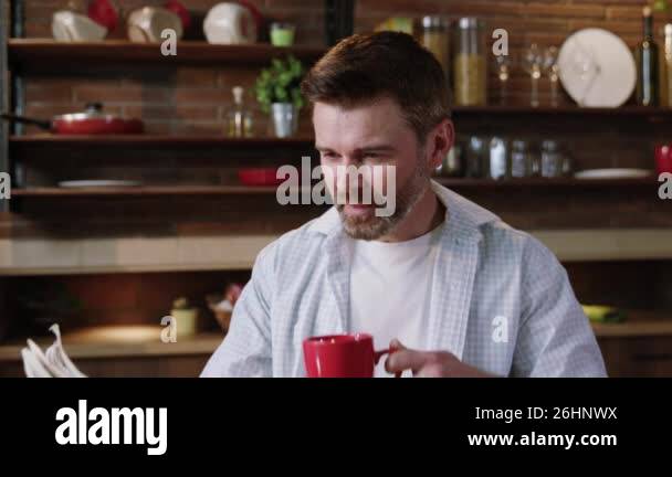 Portrait of attractive man in shock of reading exciting news on a ...