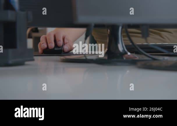 A skilled hand uses a mouse at a tidy desk, highlighting the importance ...