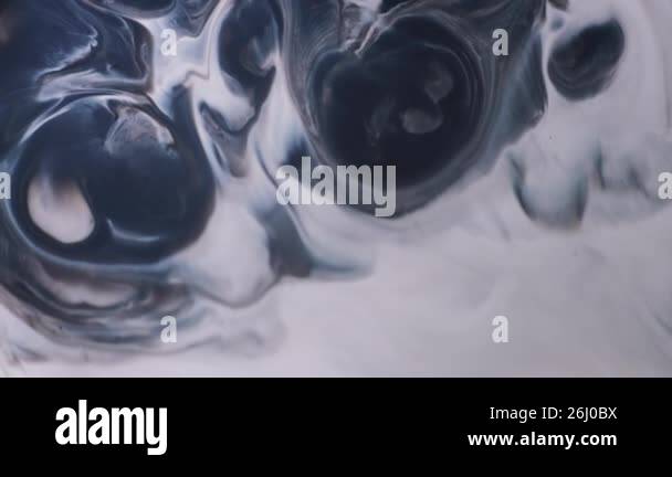 Art fluid. Paint pigment. Defocused blob spread white gray liquid ...