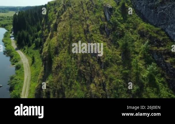 Enjoy breathtaking aerial views of vibrant cliffside landscapes beside ...