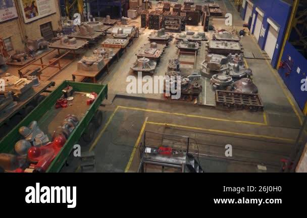 A well organized workshop featuring heavy machinery and components for ... A well organized workshop featuring heavy machinery and components for ...